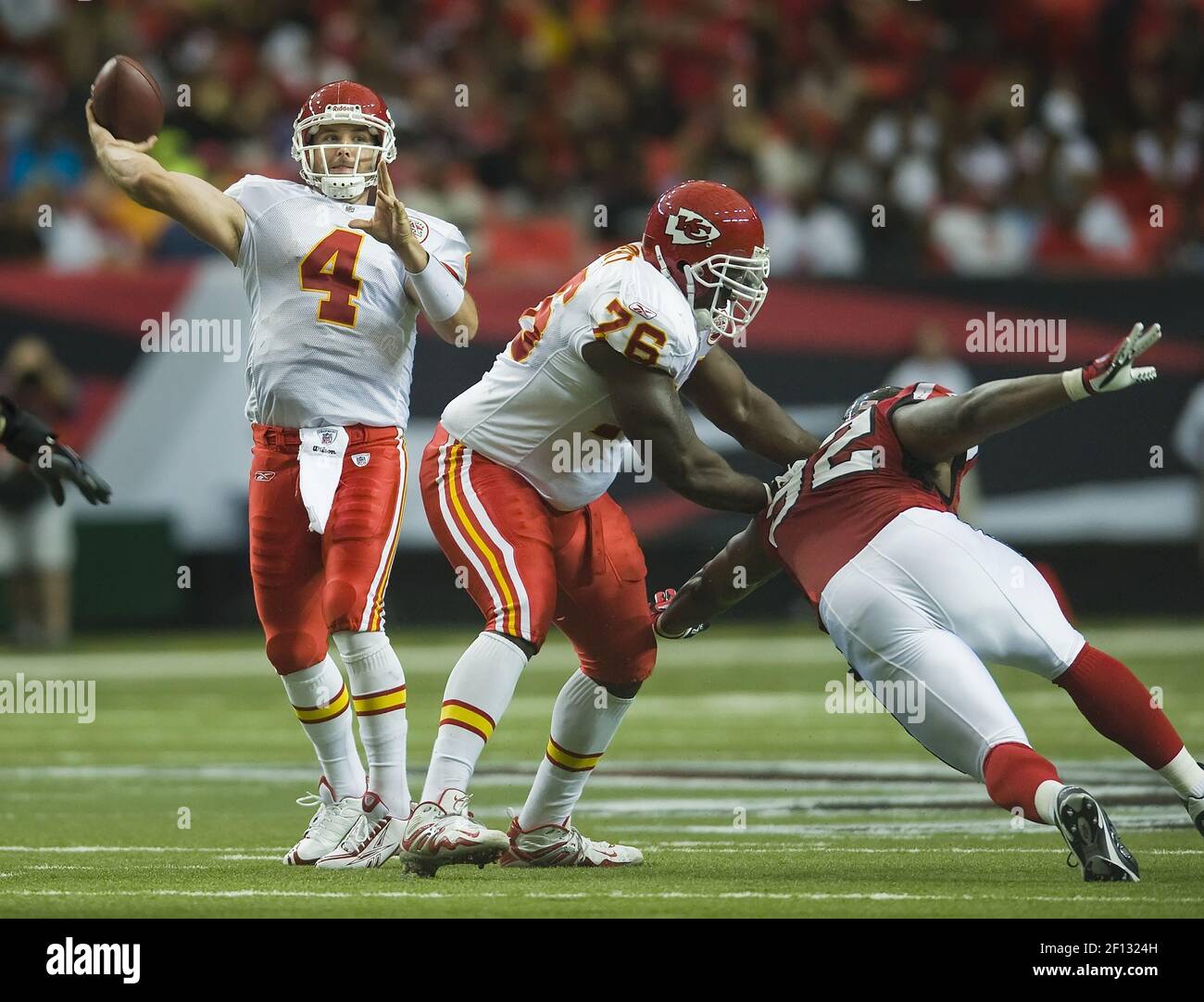 Kansas City Chiefs quarterback Tyler Thigpen, left, attempts a pass as ...