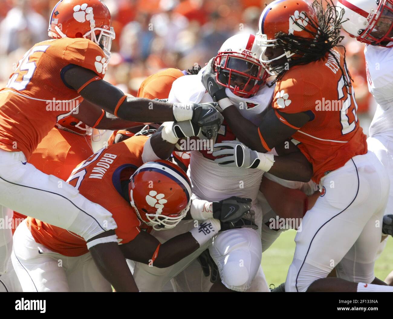 N.C. State's Curtis Underwood Jr is stopped by Clemson's Michael Hamlin ...