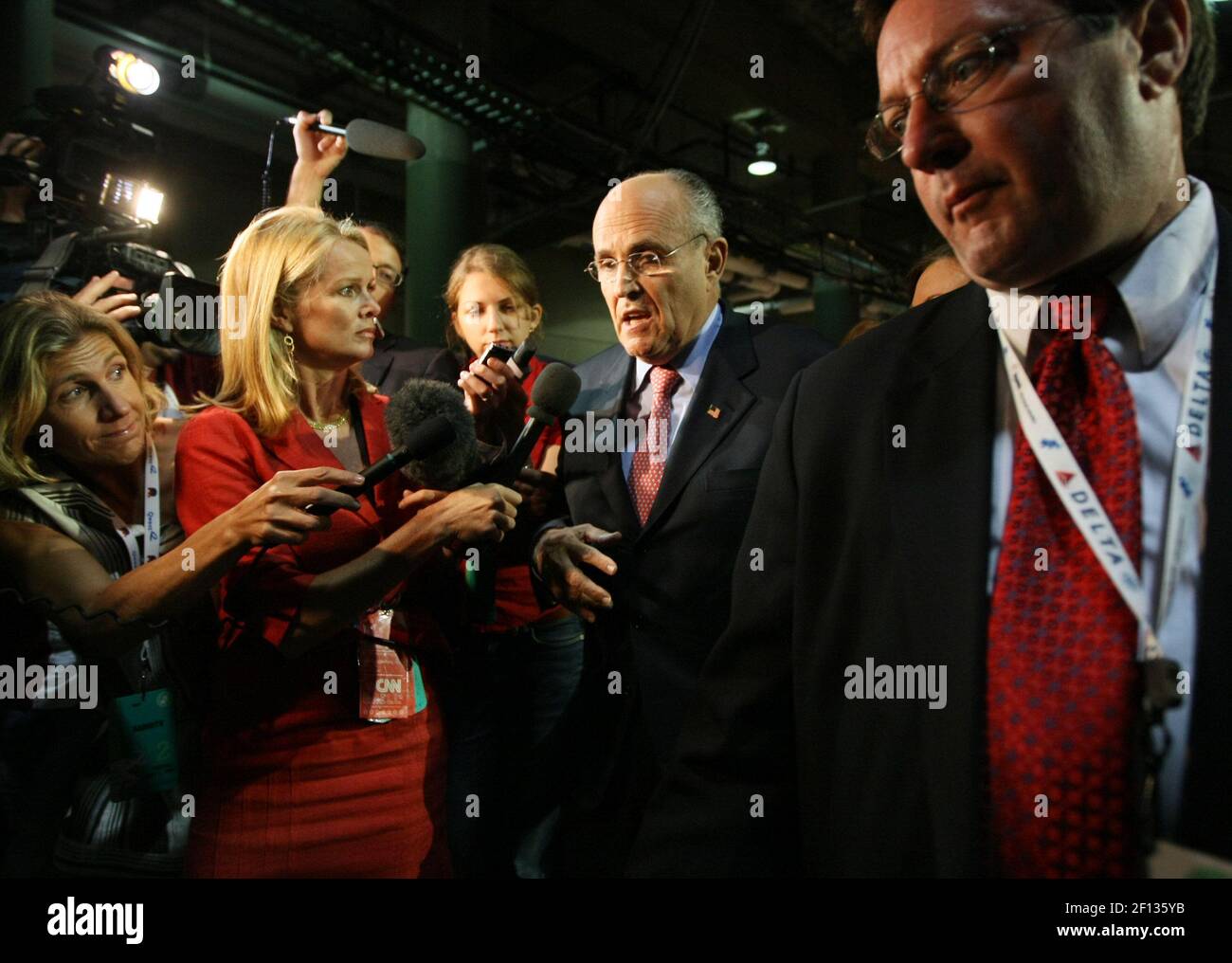 Former New York Mayor Rudy Giuliani (center) speaks to members of the ...