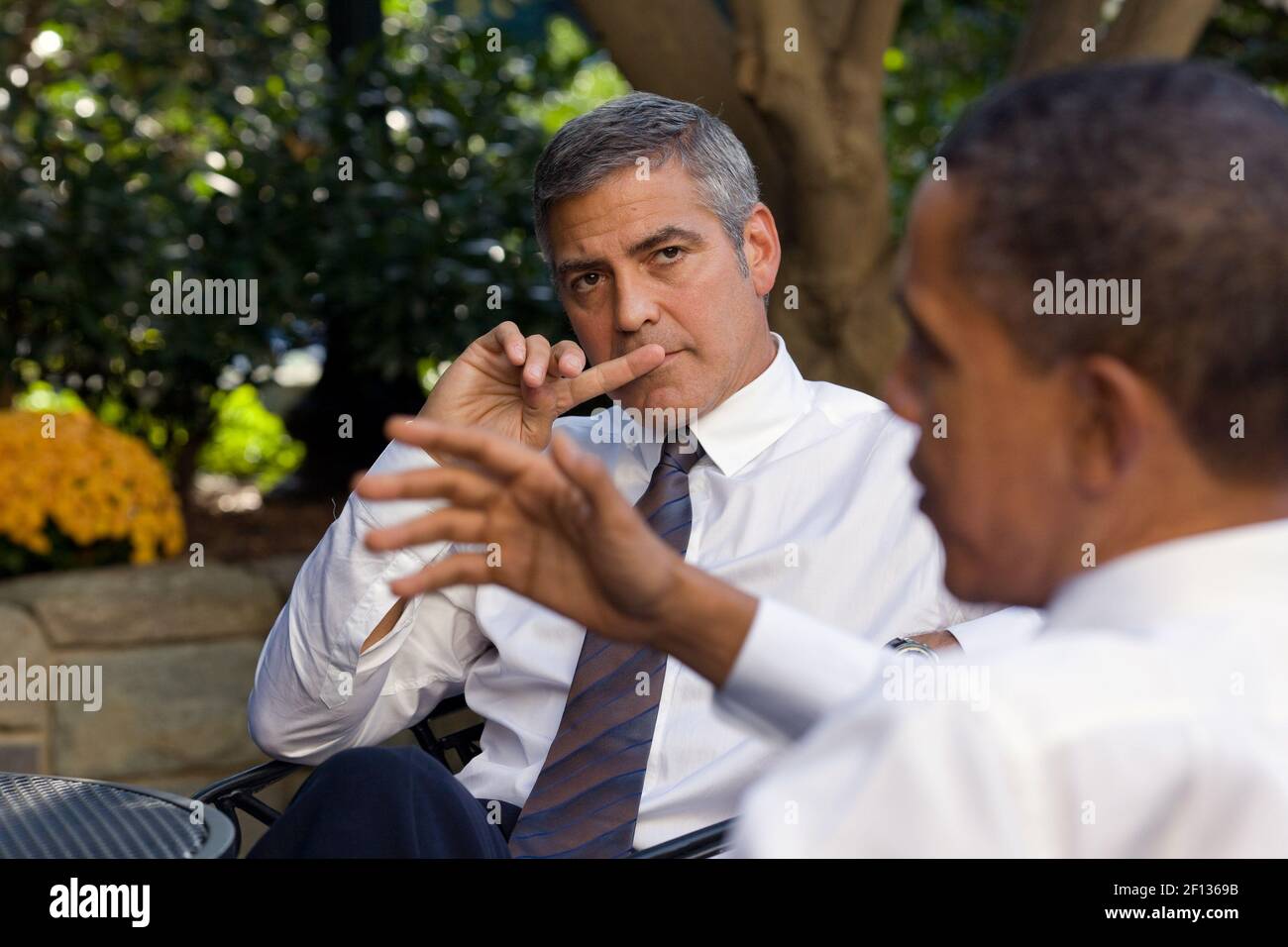 President Barack Obama talks about Sudan with actor George Clooney ...