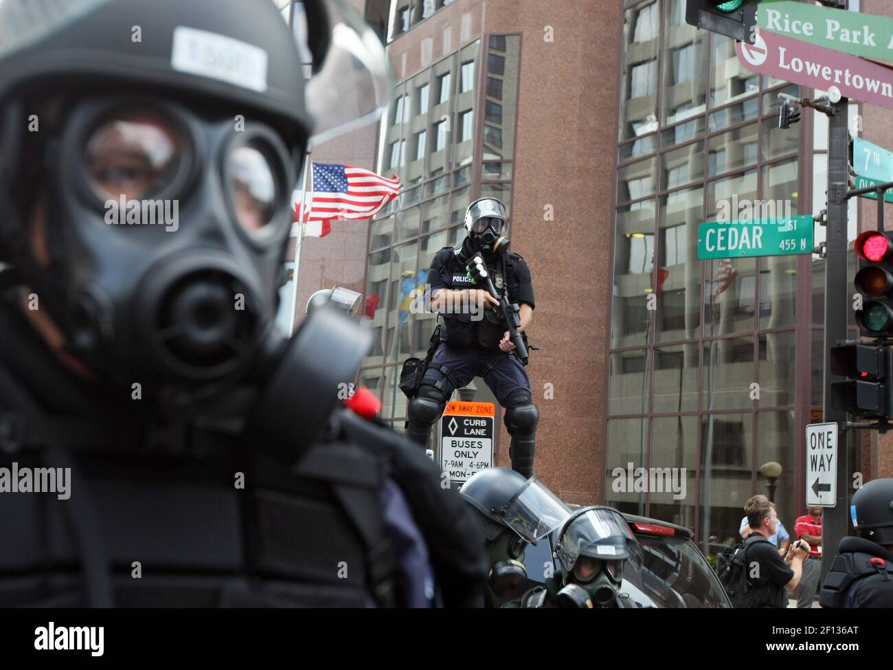 Riot police stand on the ready during a protest march from the ...