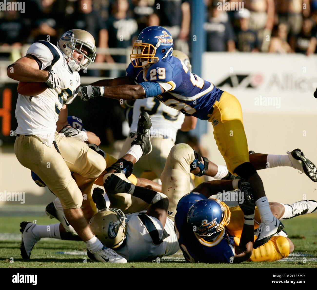 UC-Davis running back Joe Trombetta (9) slips away from San Jose State ...