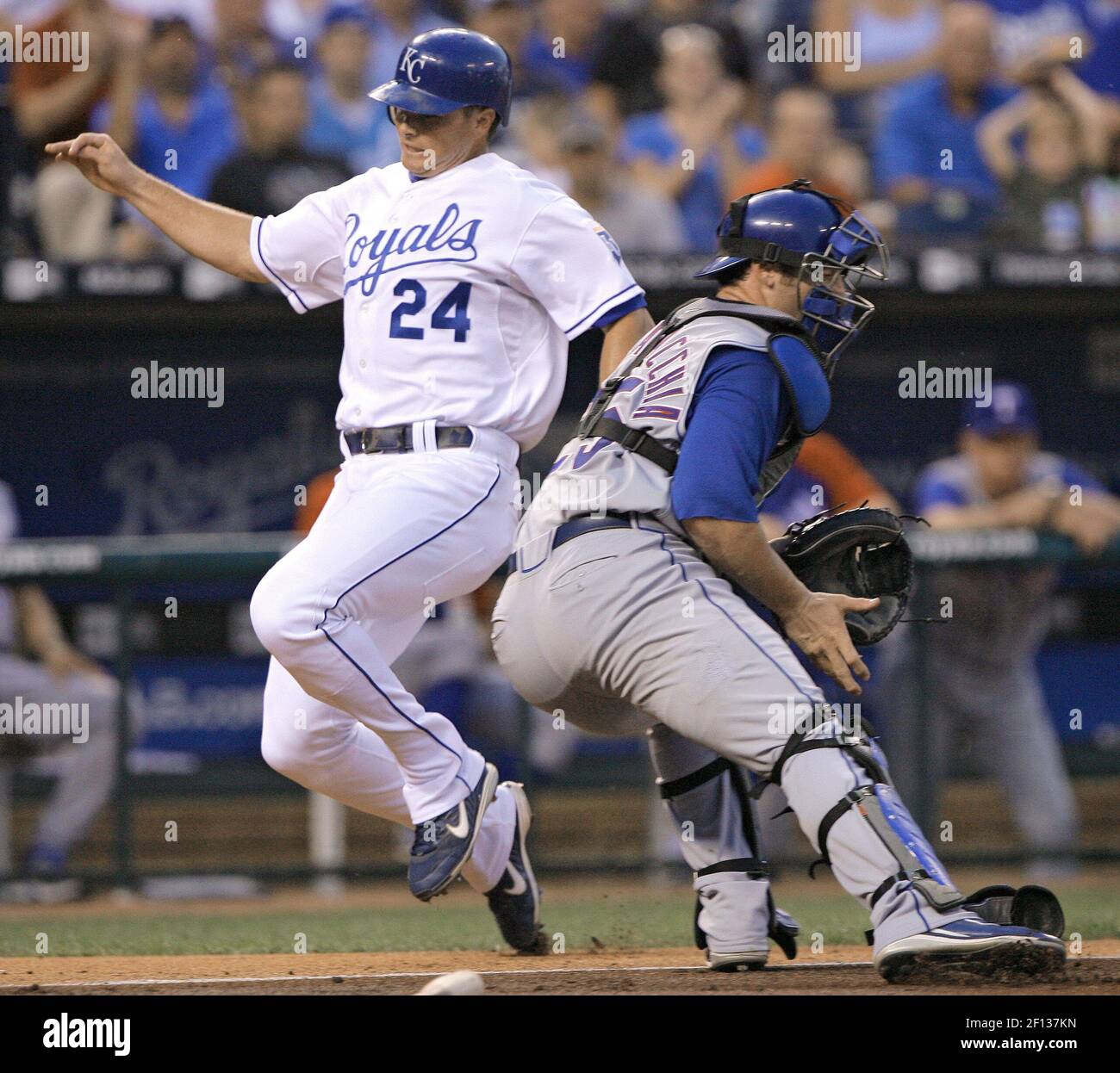 Kansas City Royals Mark Teahen (24) scores before the tag from Texas ...