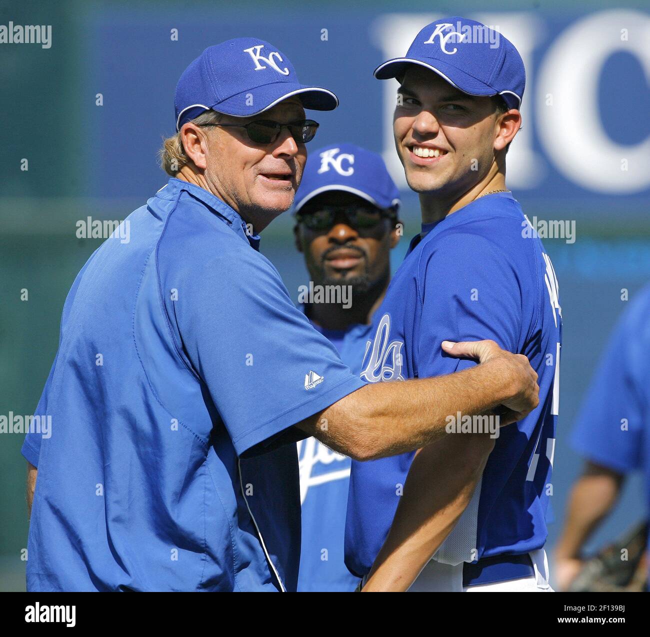 Kansas City Royals first base coach Rusty Kuntz, left, joked around ...