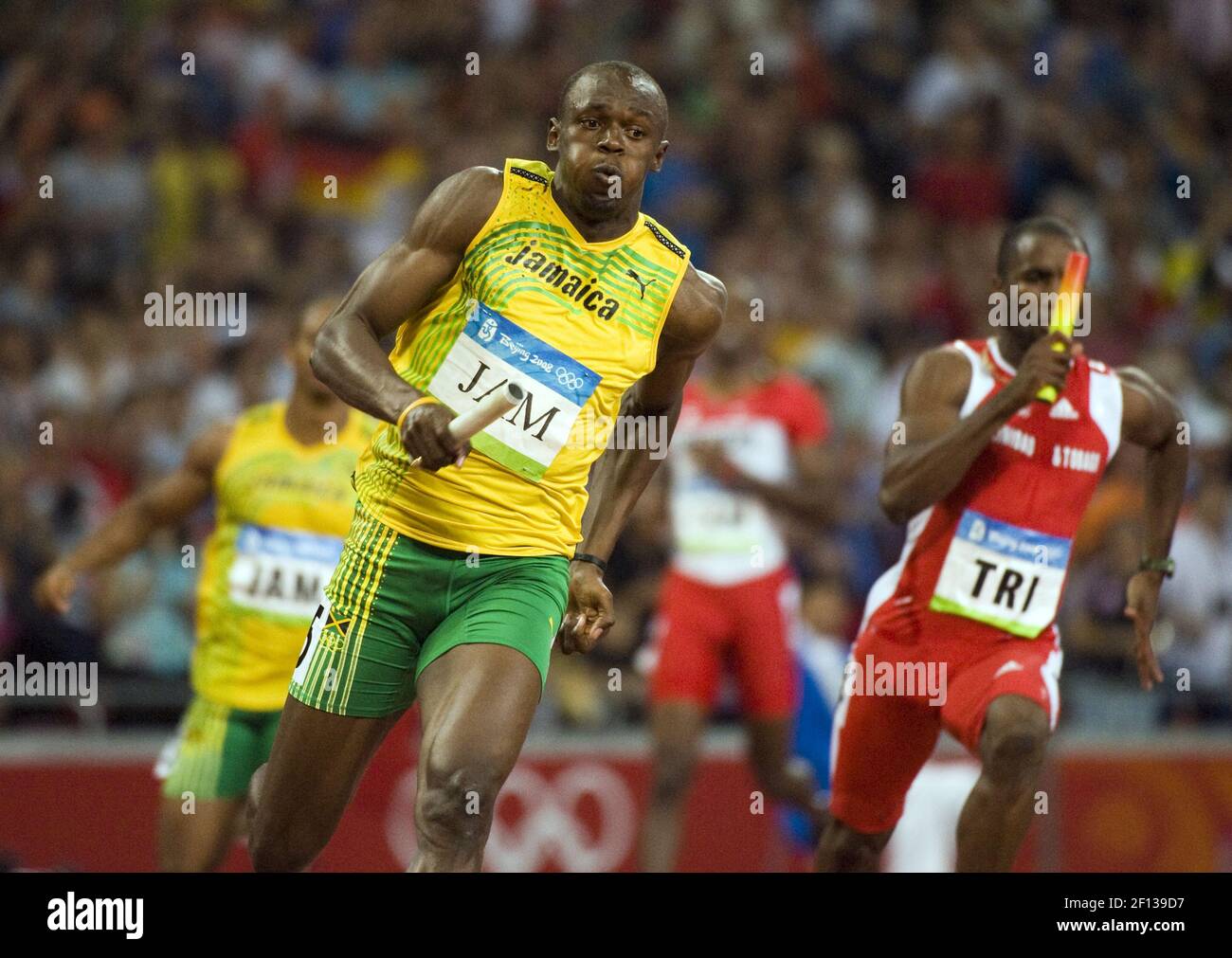 Usain Bolt of Jamaica anchors the 4x100-meter relay team to gold on ...