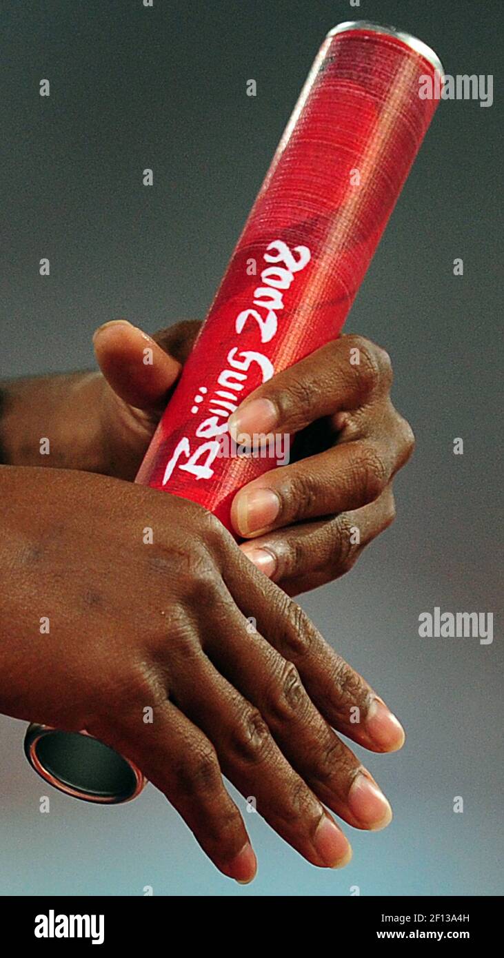 Rodney Martin of the United States holds the baton before starting a ...