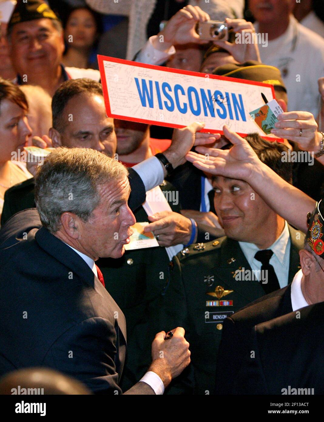 President George W. Bush responds to cheering veterans after speaking ...