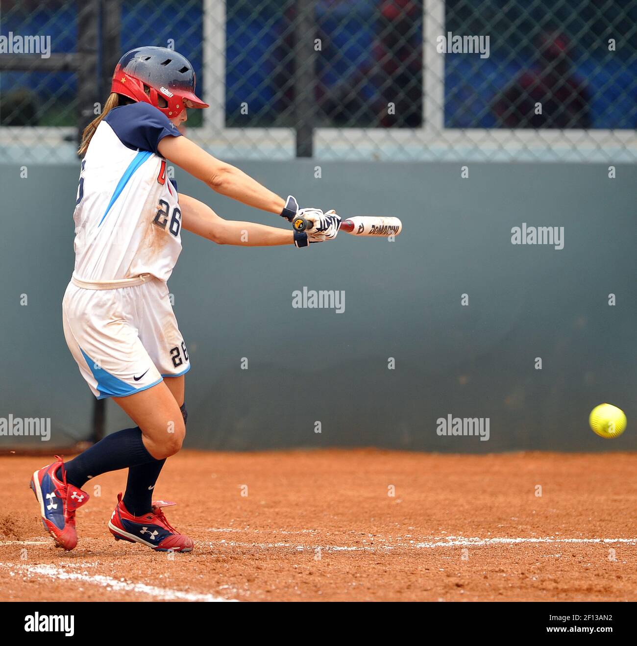 Caitlin Lowe of the United States drives in a run in the ninth inning ...