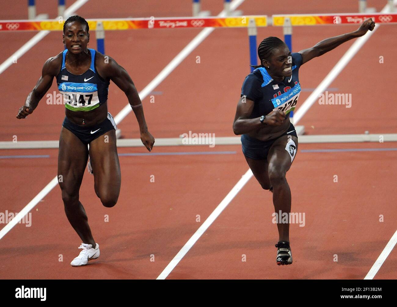 Dawn Harper, right, and Damu Cherry of the United States cross the ...