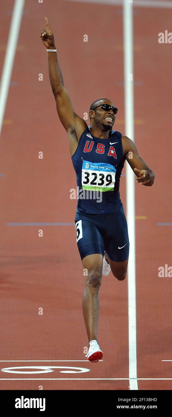 Angelo Taylor of the United States celebrates gold in the 400-meter ...