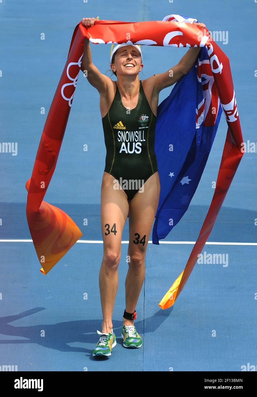Emma Snowsill of Australia crosses the line for gold in the triathlon ...