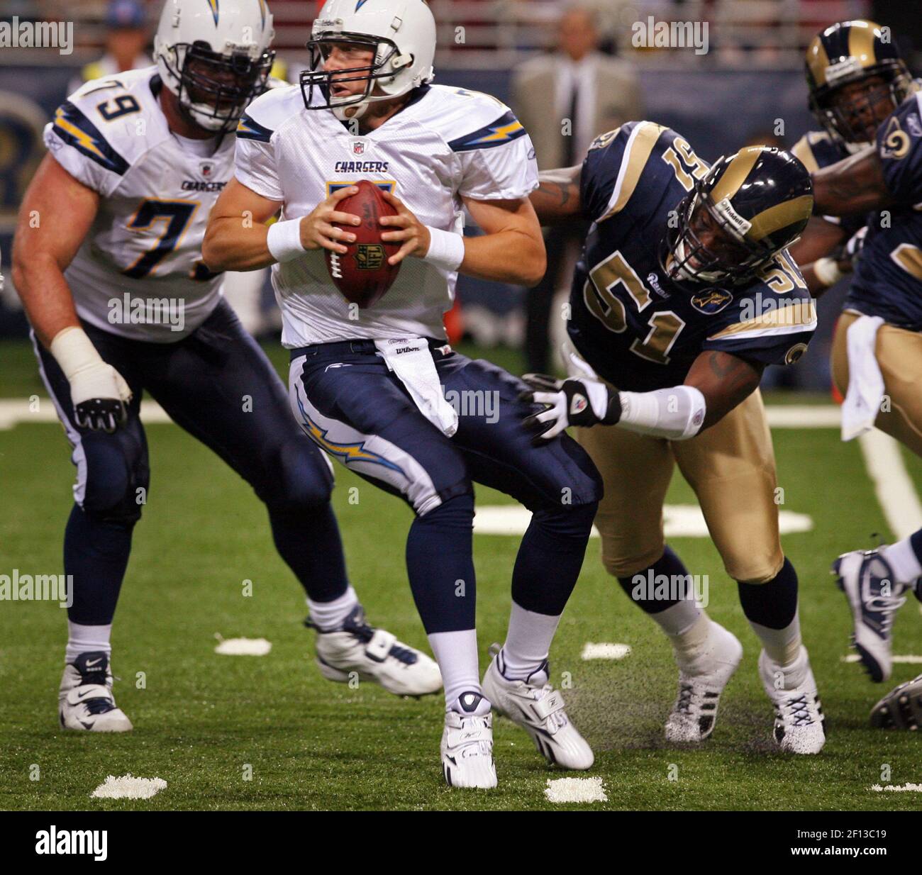 San Diego Chargers quarterback Billy Volek is dragged down by St. Louis ...