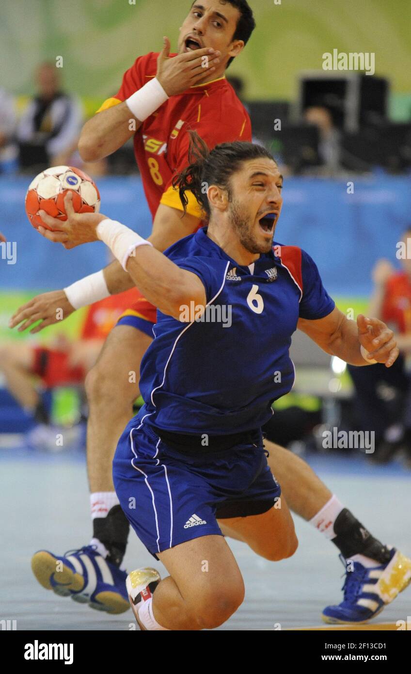 Bertrand Gille of France goes for a shot against Spain in handball on ...