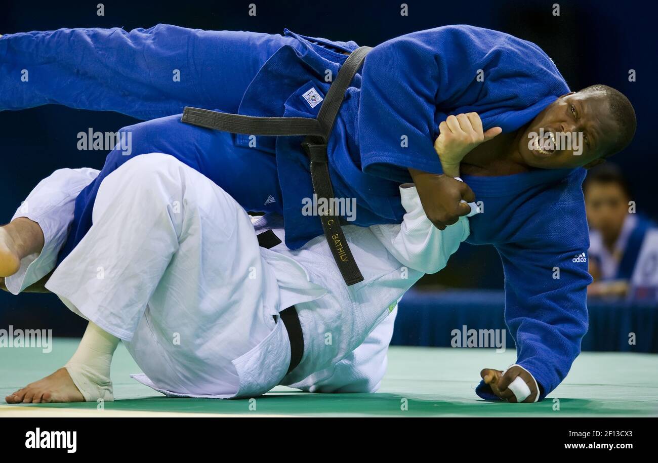 Daniel McCormick of the United States, bottom, battles Djegui Bathily ...
