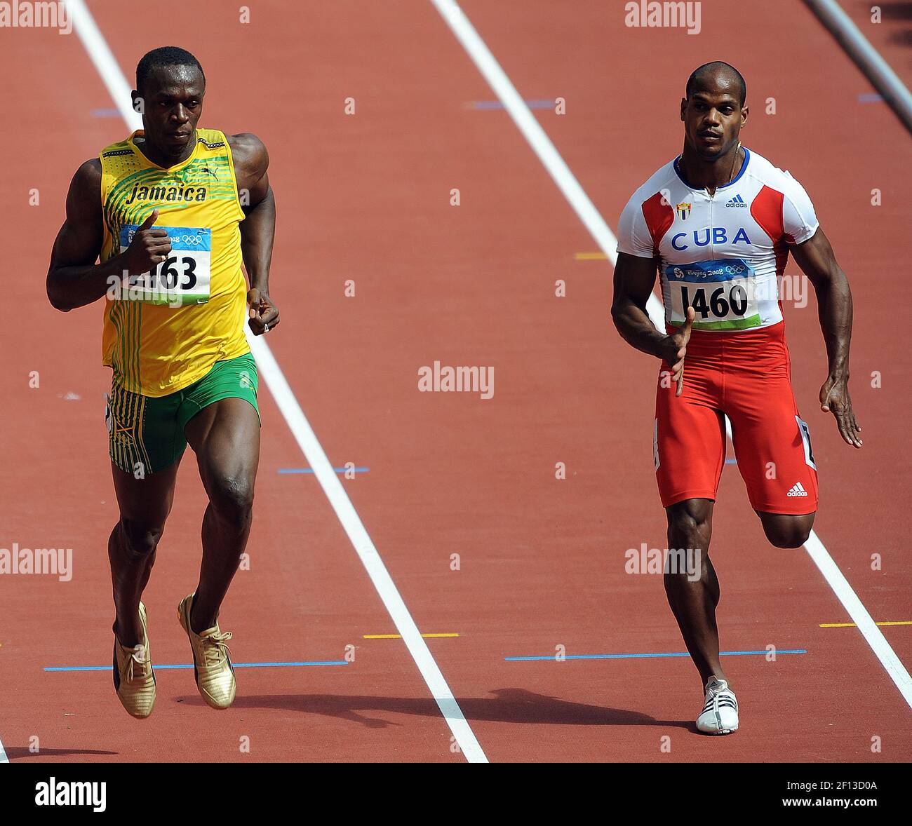 Usain Bolt of Jamaica, left, and Jenris Vizcaino of Cuba compete in 100 ...