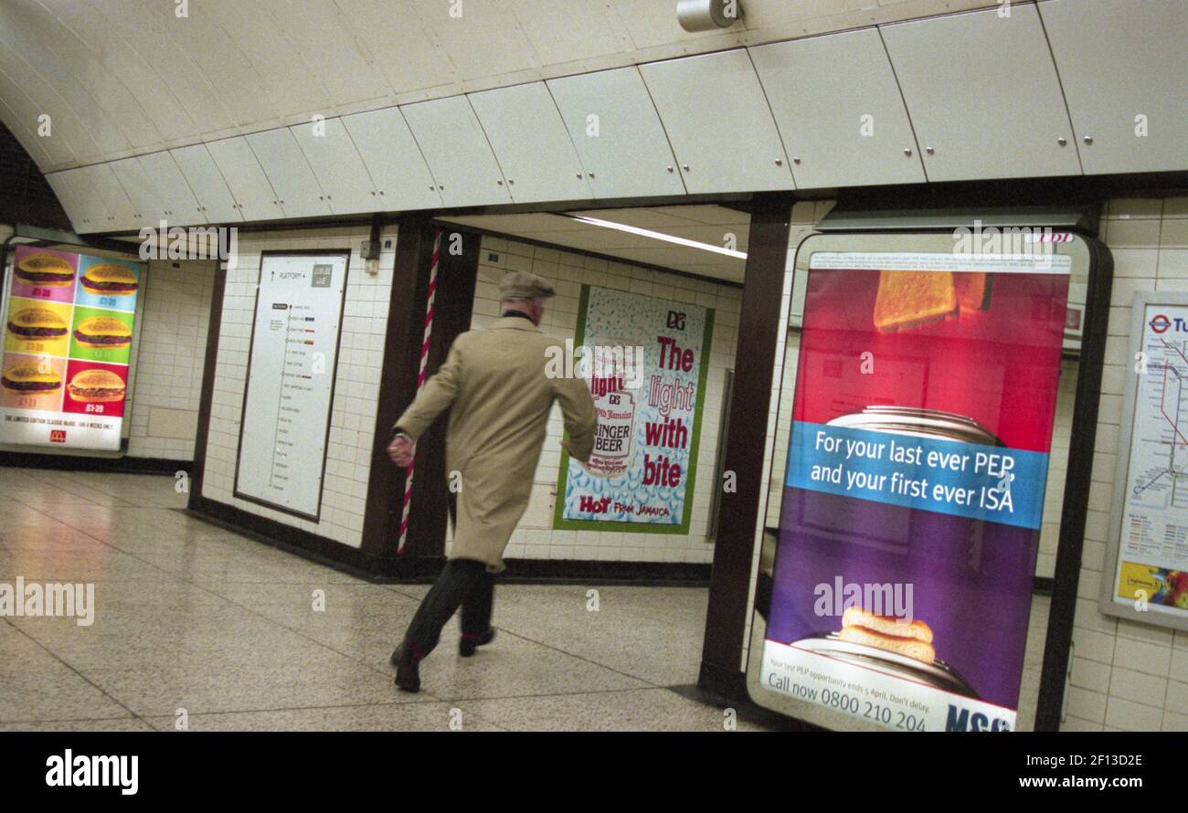 Man running for a train in the london underground Stock Photo - Alamy
