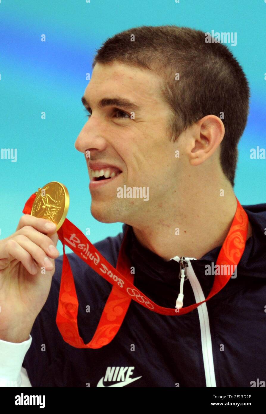 Michael Phelps of the United States celebrates winning the gold medal ...