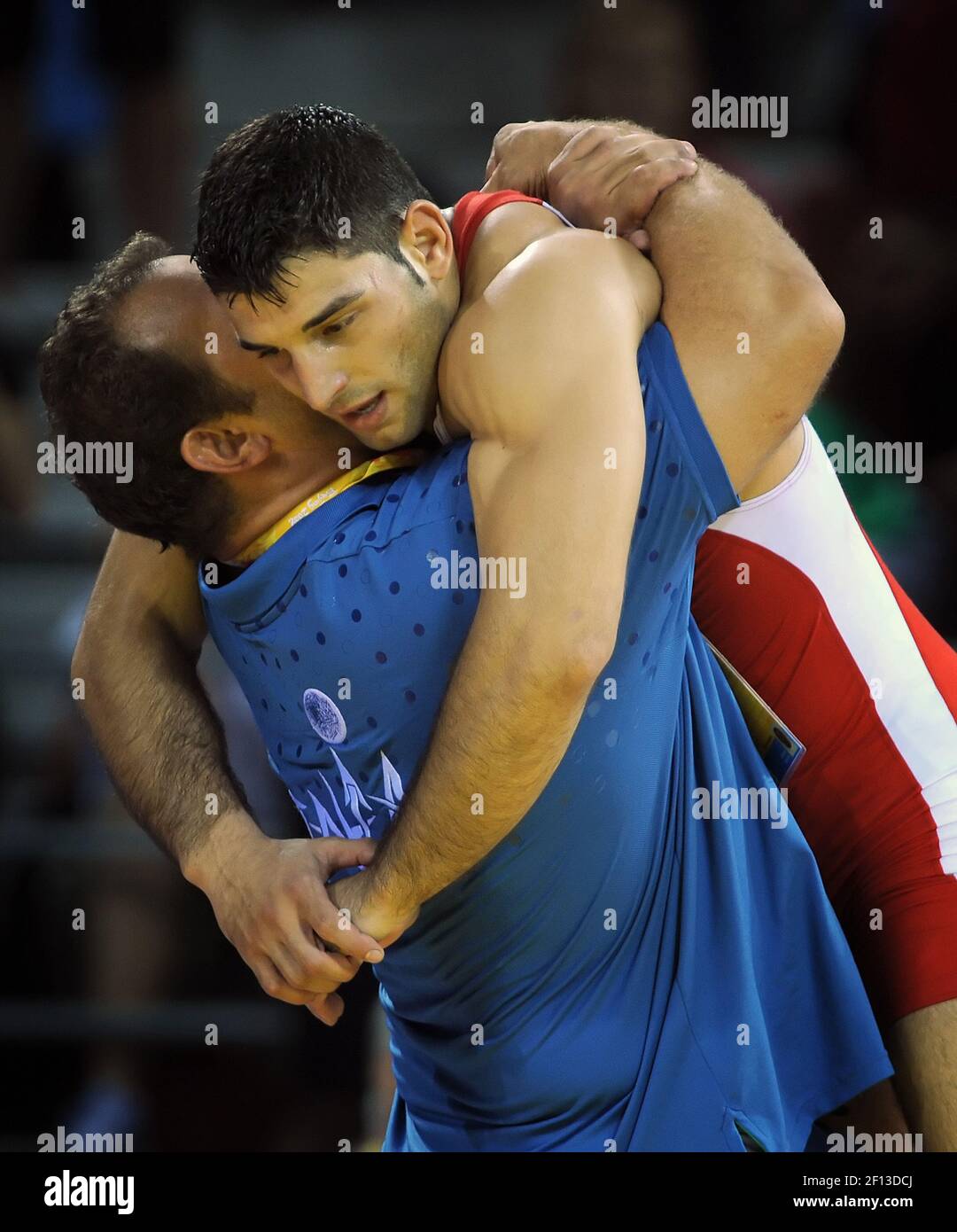 Andrea Minguzzi of Italy celebrates with a coach after his victory in ...