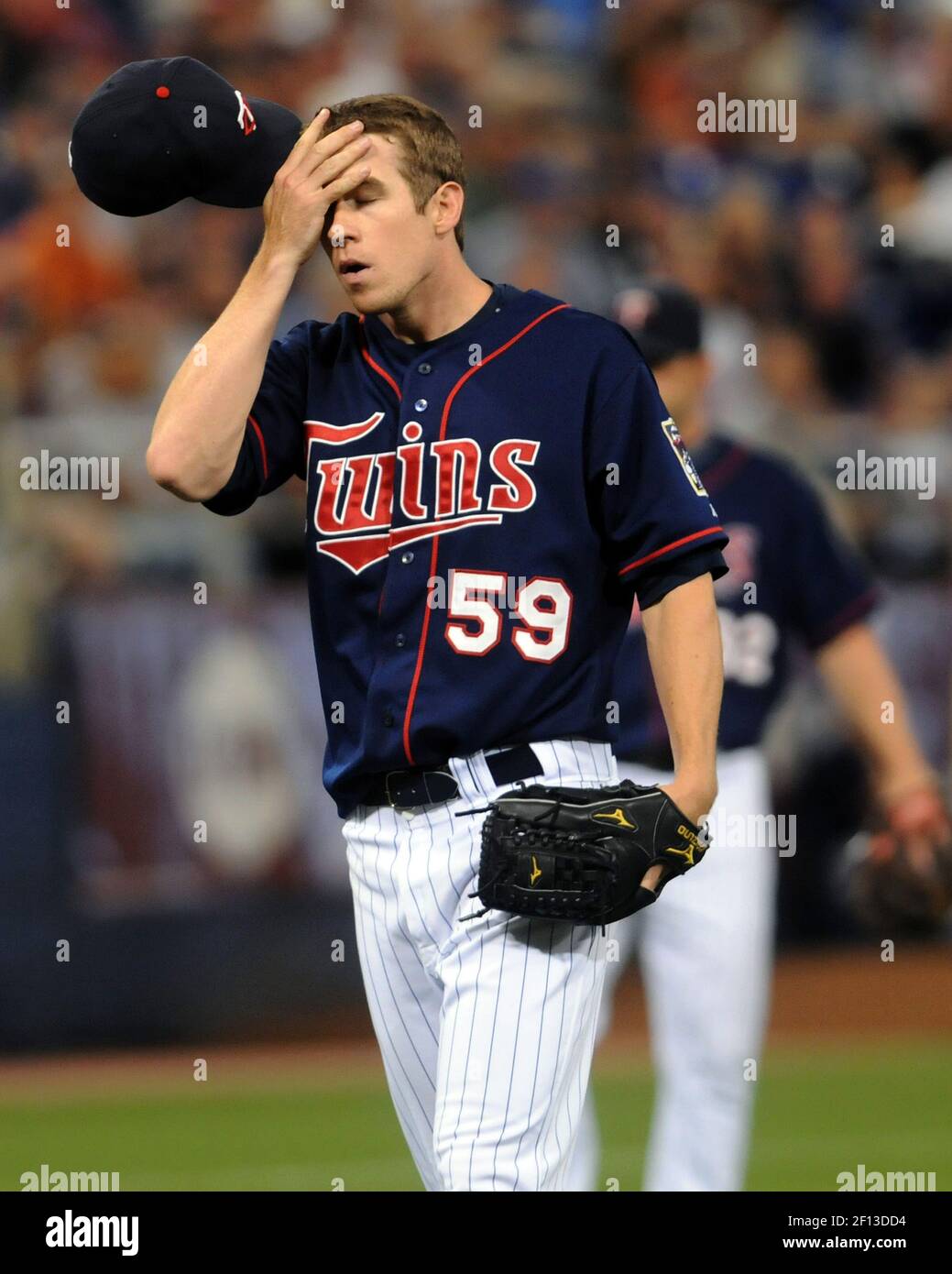 Minnesota Twins pitcher Kevin Slowey reacts after giving up a double to ...
