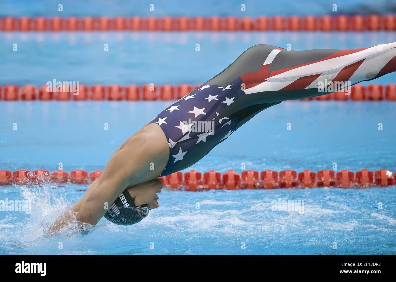 Ricky Berens of the United States swims the third leg on the way to ...
