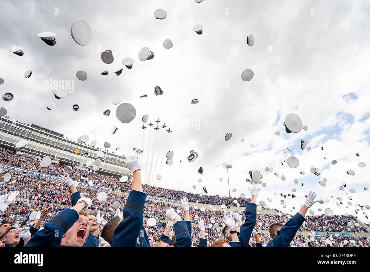 U.S. Air Force Cadets toss their hats as the Thunderbirds fly-over at ...