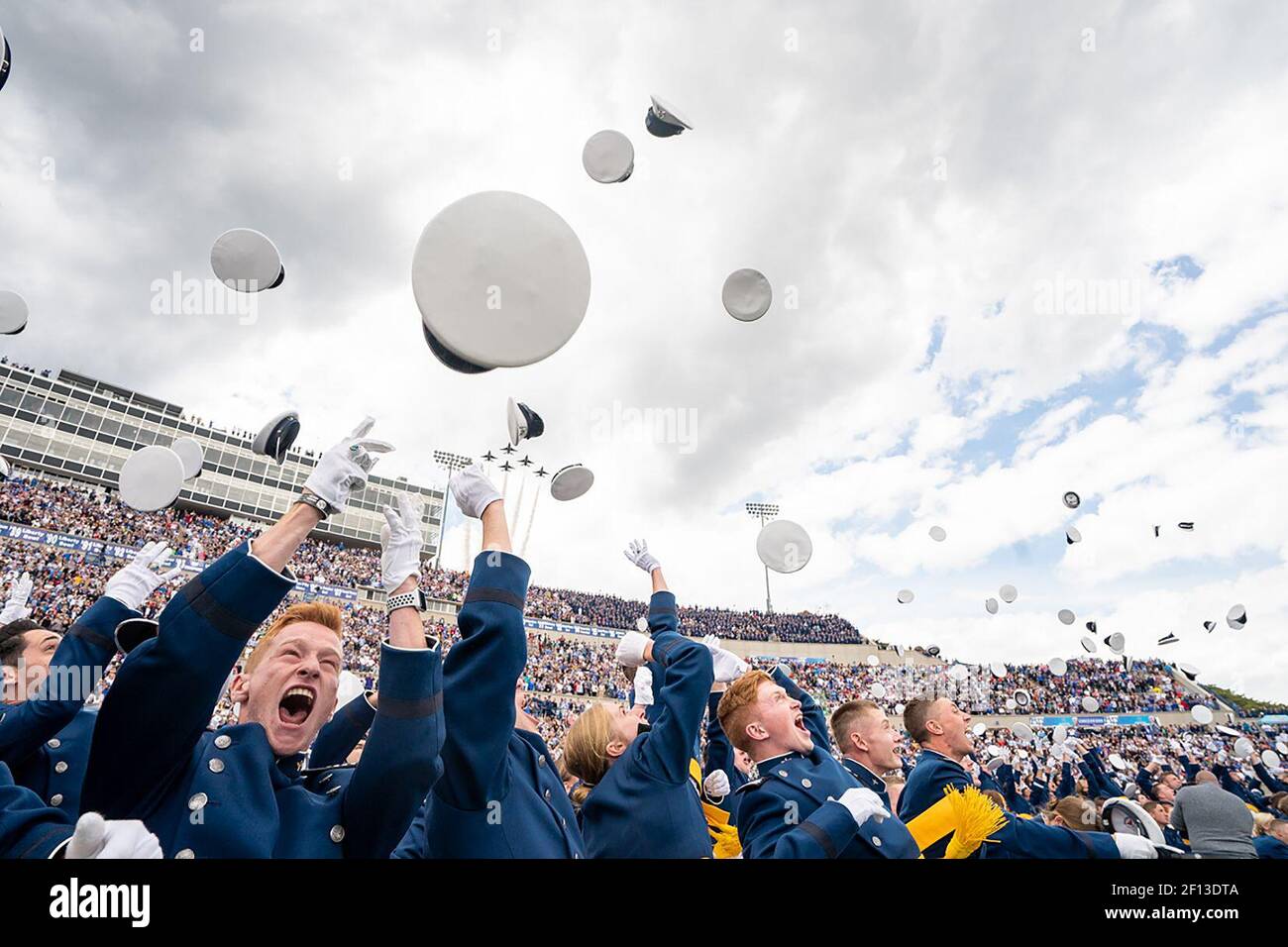 U.S. Air Force Cadets toss their hats as the Thunderbirds fly-over at ...
