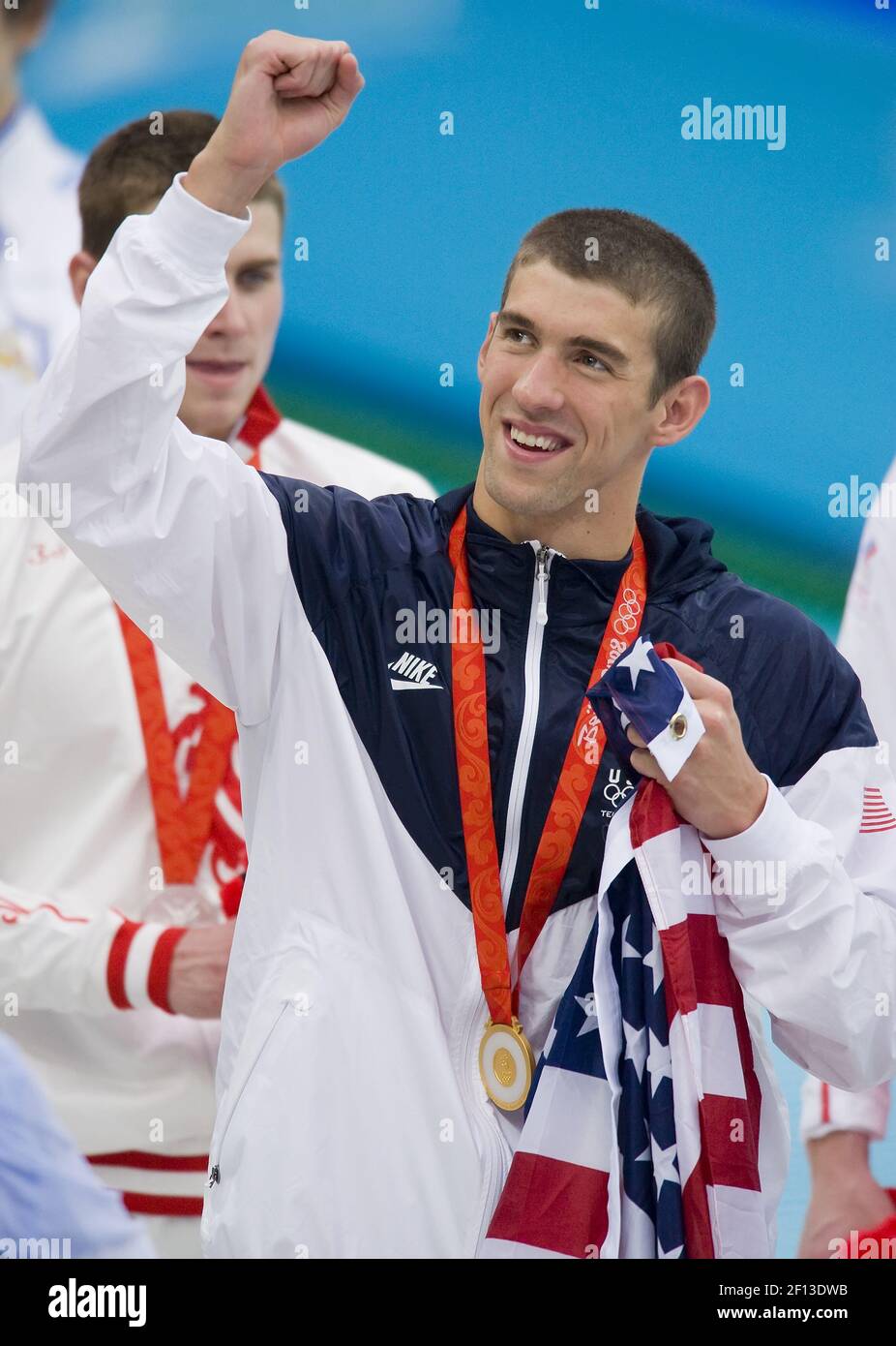 Michael Phelps of the United States smiles with his gold medal in the ...