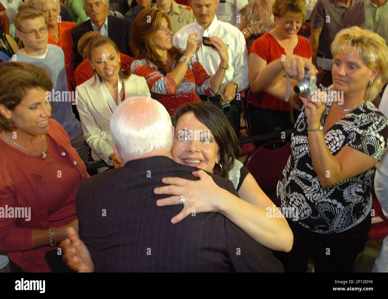 GOP presidential candidate Sen. John McCain (R-AZ) hugs Julie Landis ...
