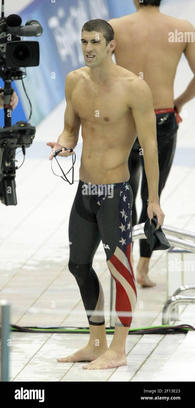 Michael Phelps of the United States walks on the pool deck after ...