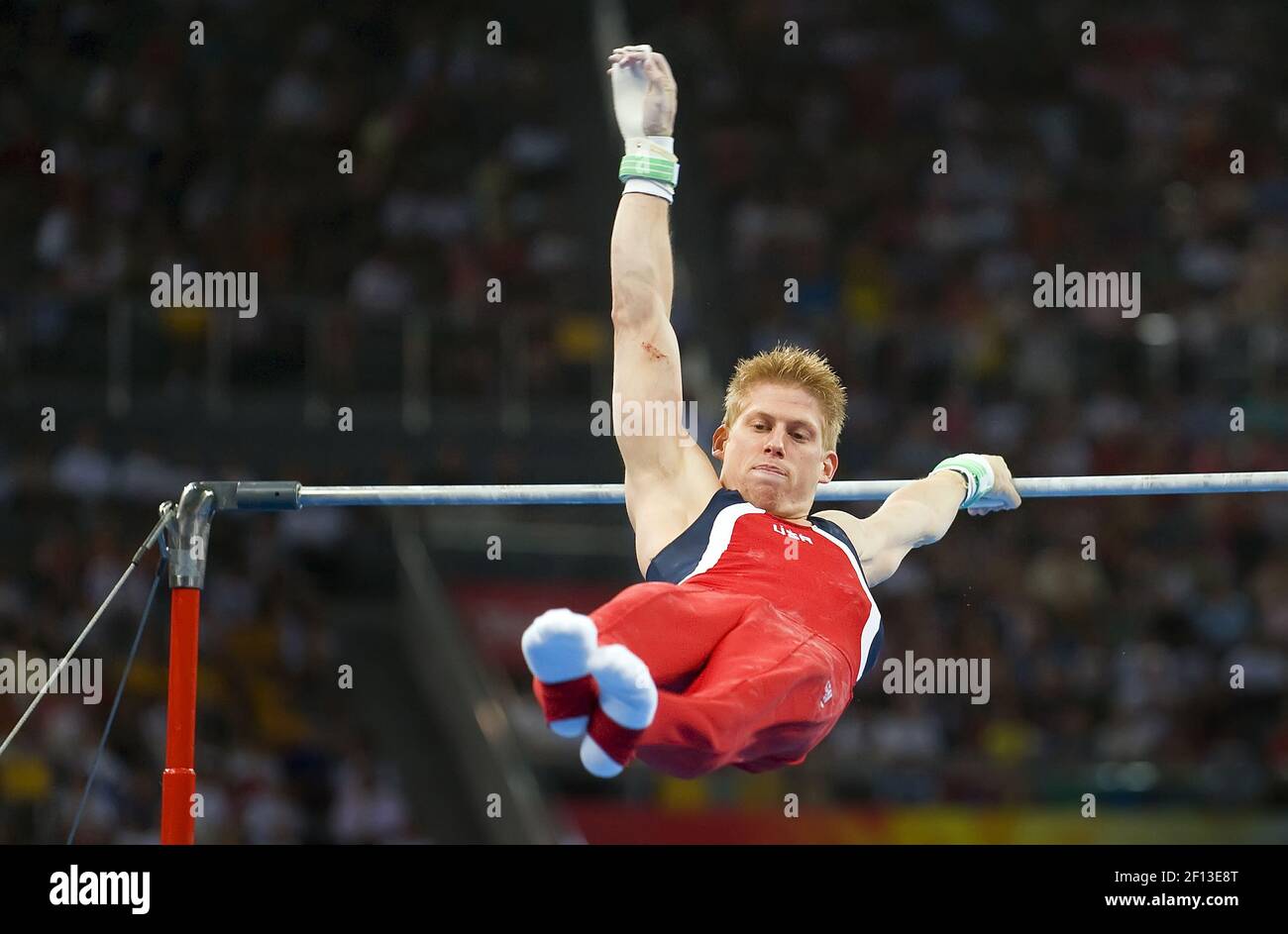 Justin Spring of the United States competes on the horizontal bar ...