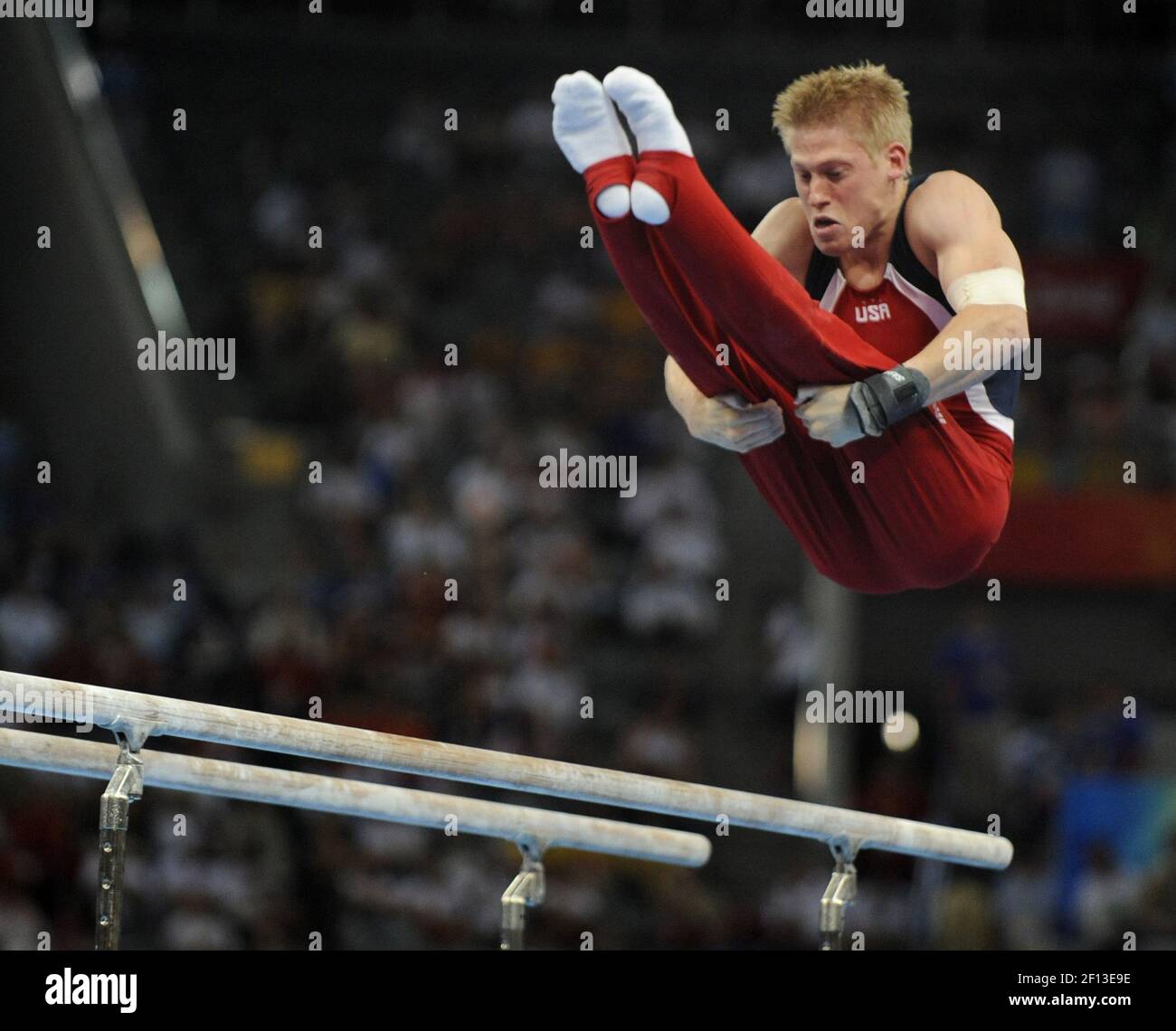 Justin Spring of the United States competes on the parallel bars in the ...