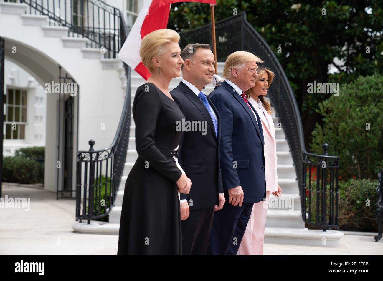 President Donald Trump and First Lady Melania Trump pose for a photo ...