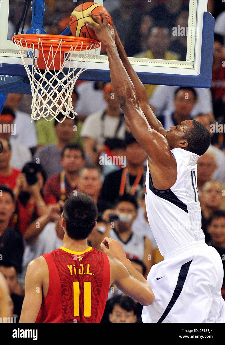 USA's Dwayne Wade (9) dunks over China's Jianian Yi (11) in the 1st ...