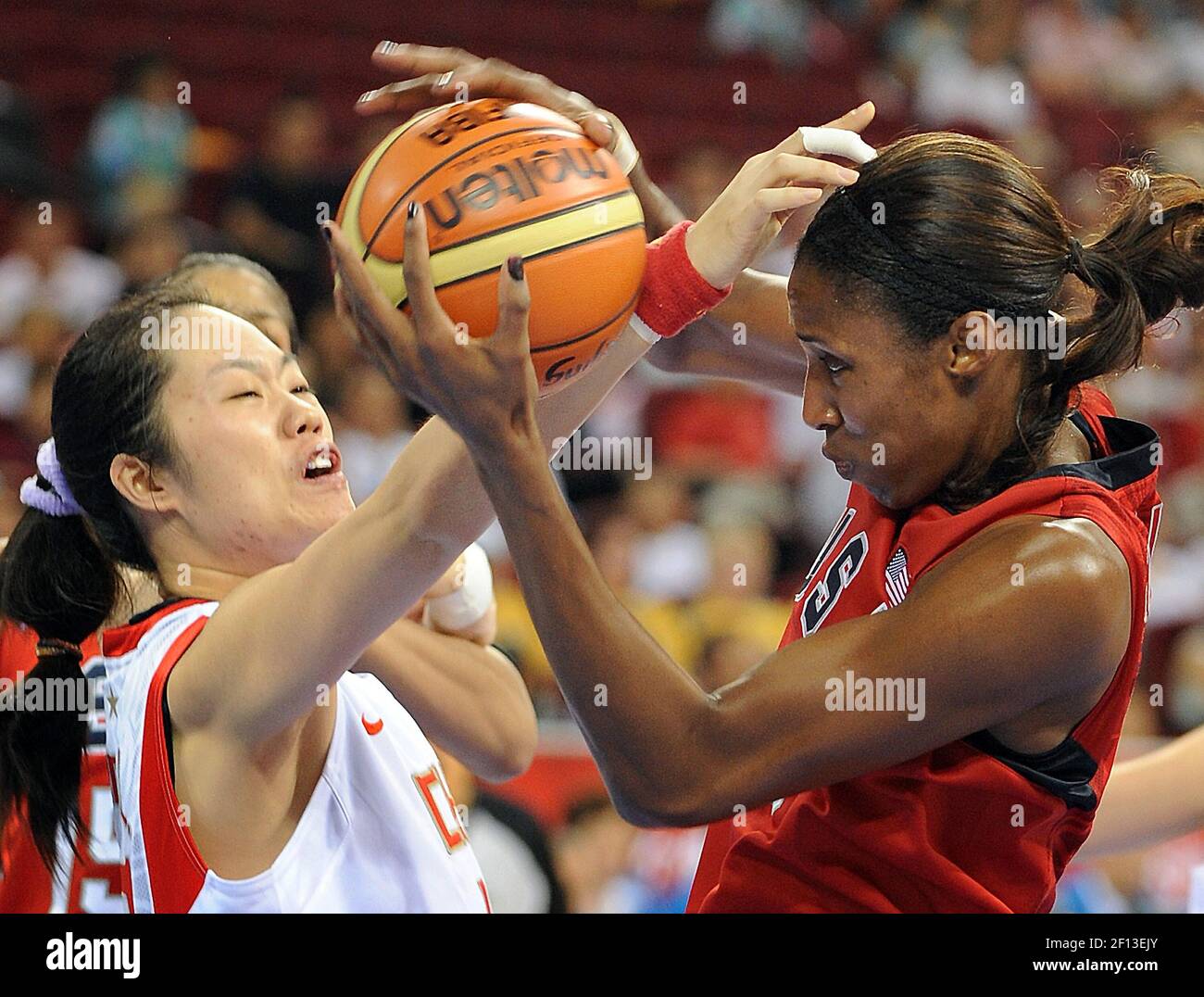 Lisa Leslie of the United States, right, battles Xiaoli Chen of China ...