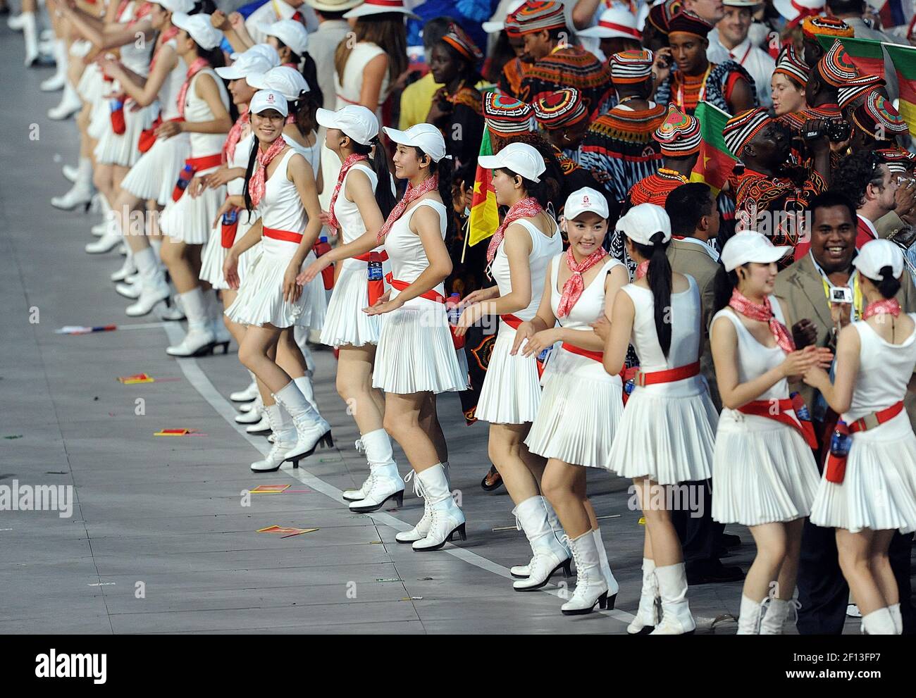 Performers form the perimeter of athletes in the National Stadium ...