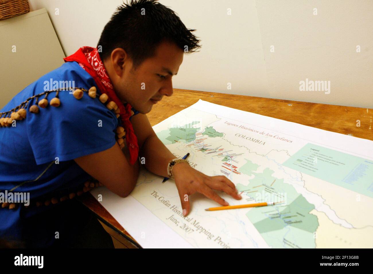 Hugo Lucitante, 21, a member of the Cofan from Ecuador, helps work on ...