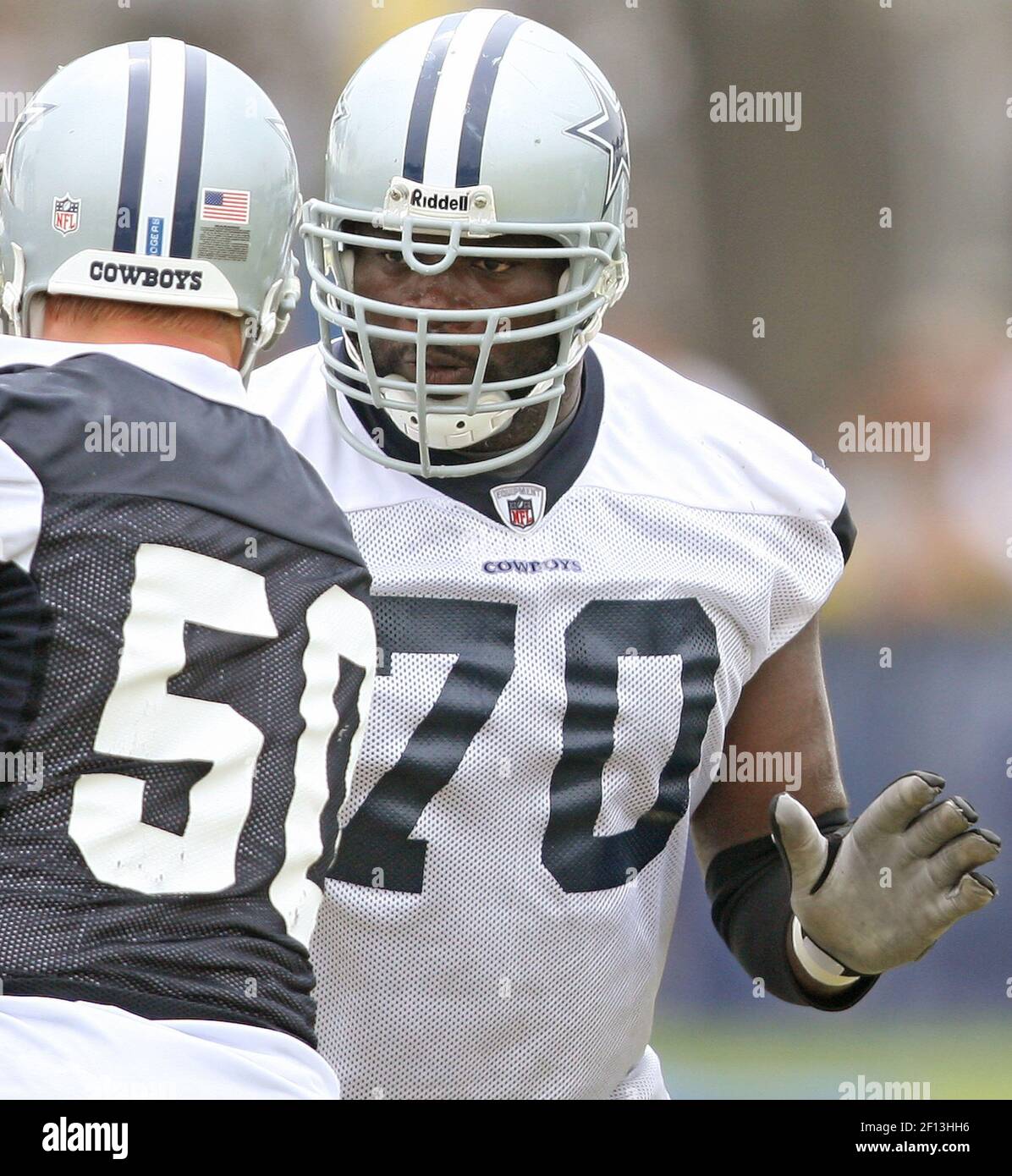 Dallas Cowboys tackle Leonard Davis (right) at work during drills with ...