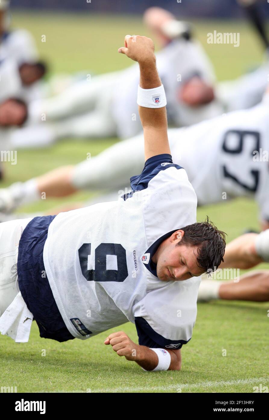 Dallas Cowboys' Tony Romo (9) stretches out with his teammates during ...