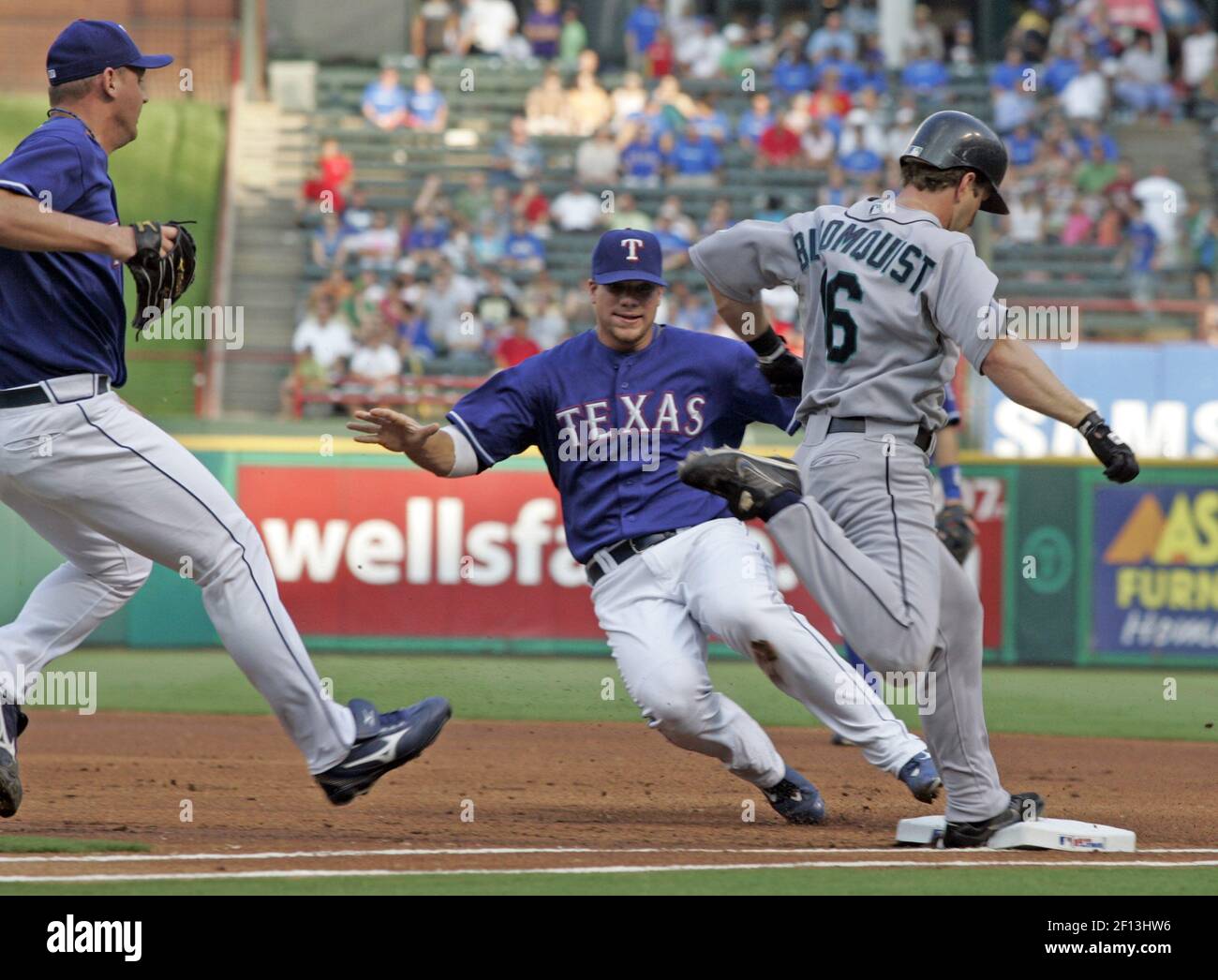 Seattle Mariners Willie Bloomquist beats Texas Rangers Matt Harrison ...