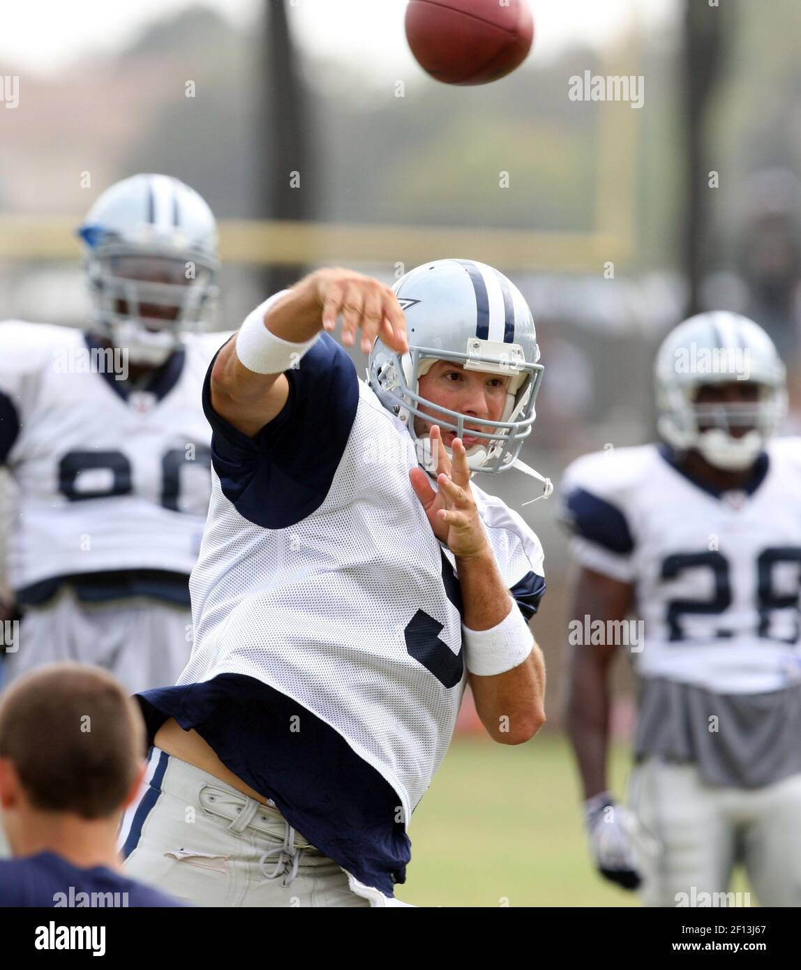 Dallas Cowboys quarterback Tony Romo delivers a pass at the morning ...