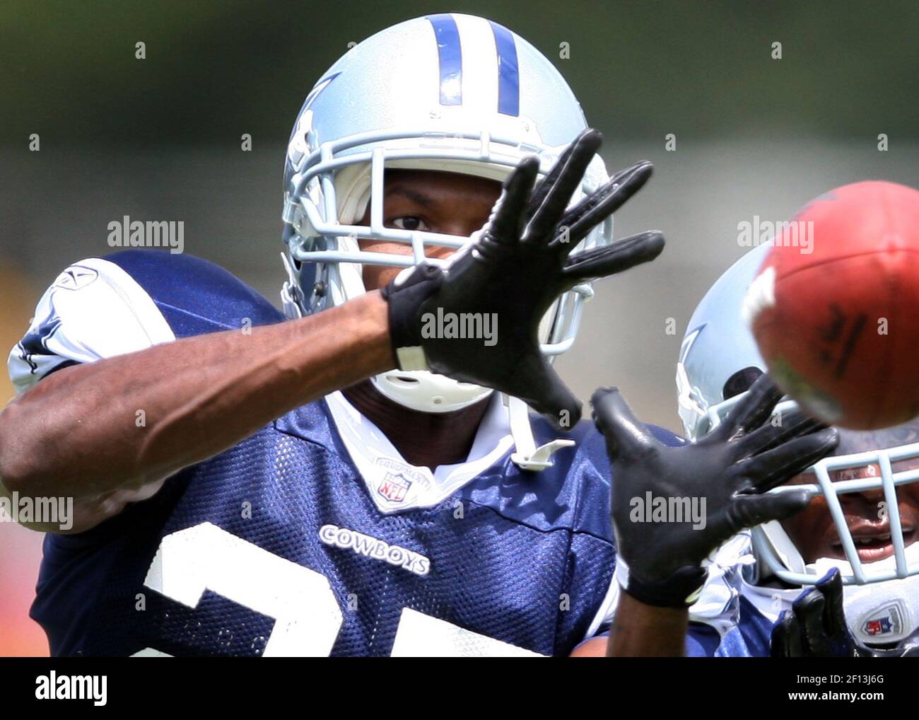 Dallas Cowboys safety Patrick Watkins catches a pass during training camp drills in Oxnard ...