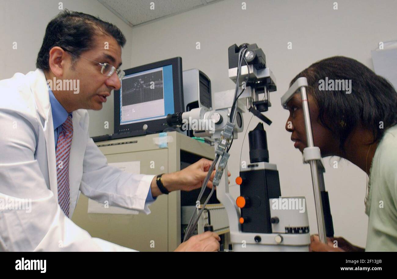 A screen, background, shows Sandra Naylor's cornea and iris in profile ...