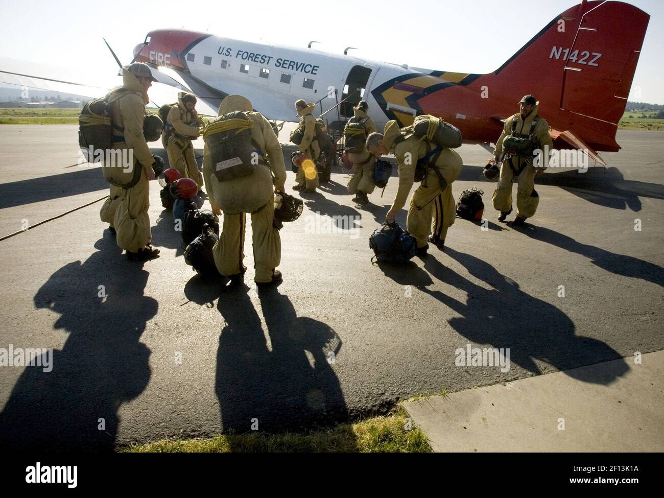 McCall Smokejumpers gather in a circle for a quick pre-jump meeting at ...