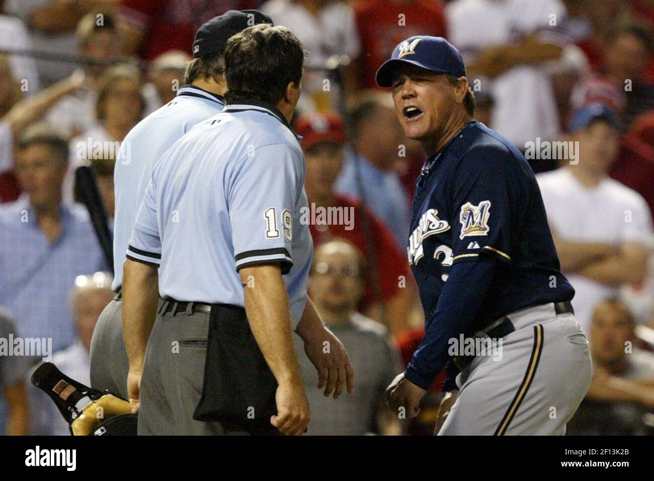 Umpire Joe West (back left) moves to get between home plate umpire Ed ...