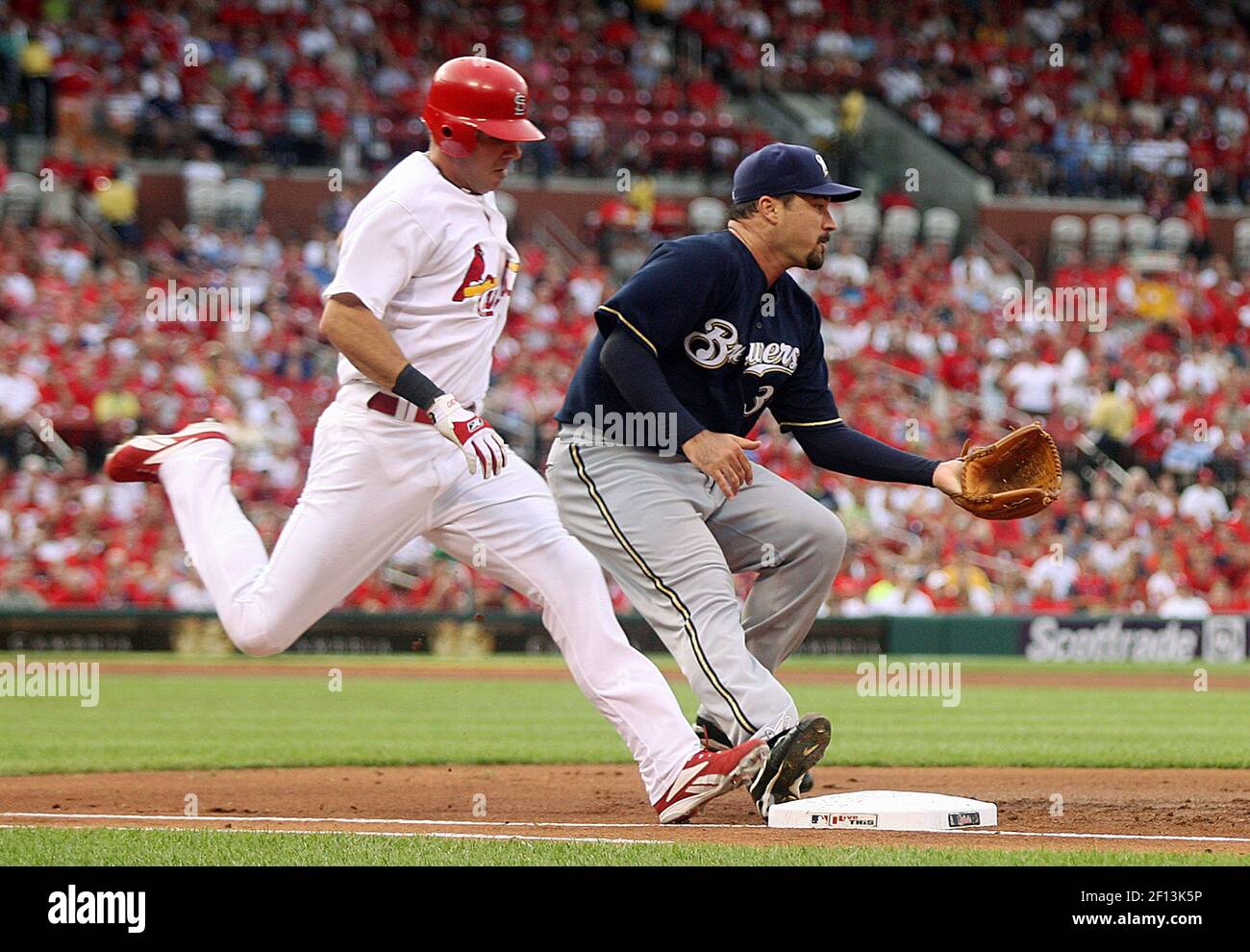 The St. Louis Cardinals' Rick Ankiel (left) beats the throw to ...