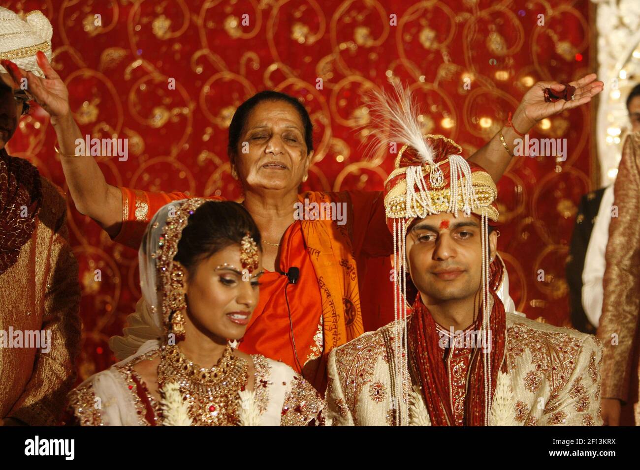 Rev. Shashi Tandon, top, presides over the traditional Hindu wedding ...