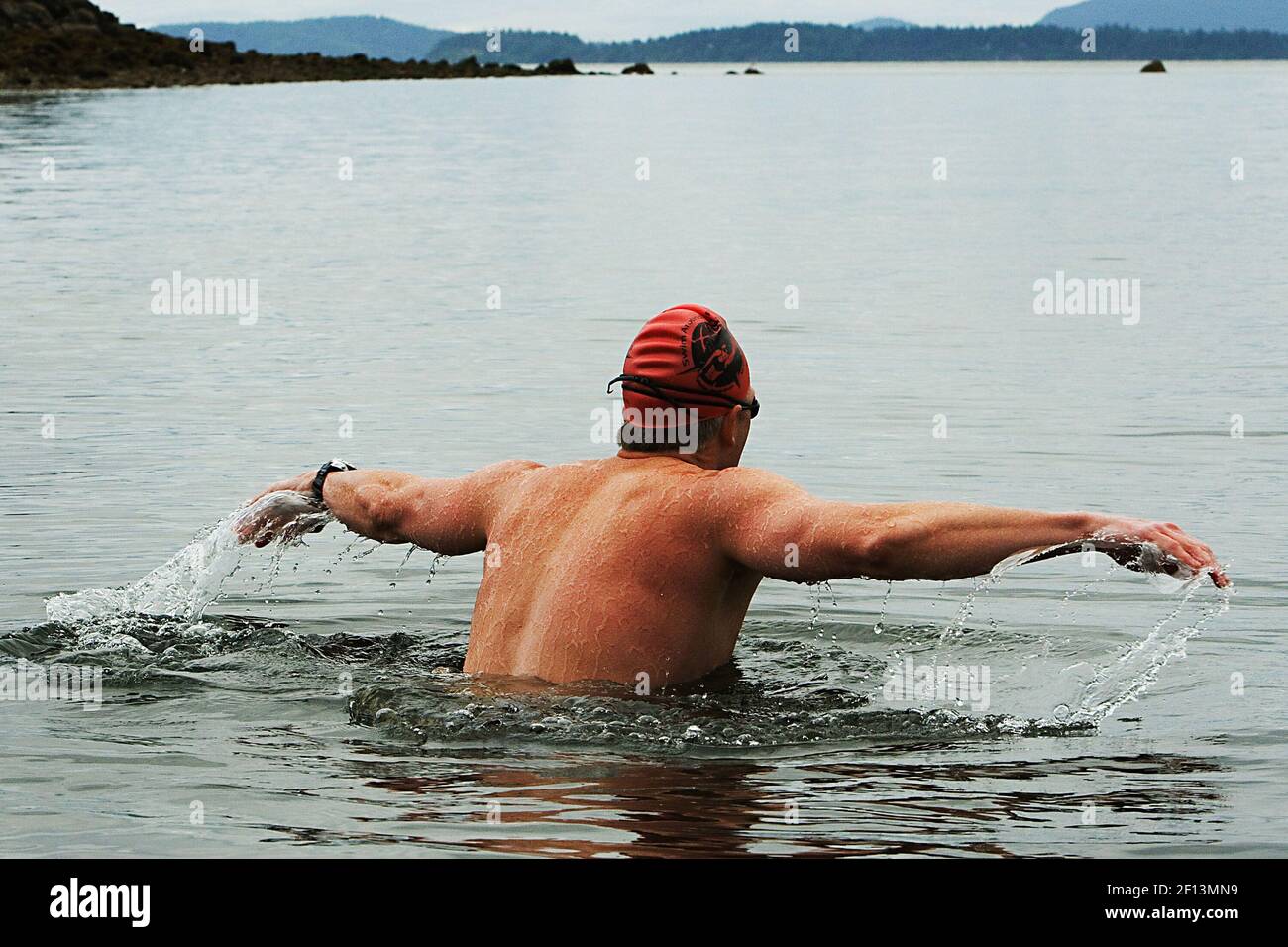 Mike Humphreys dives into Bellingham Bay for his training to swim the ...