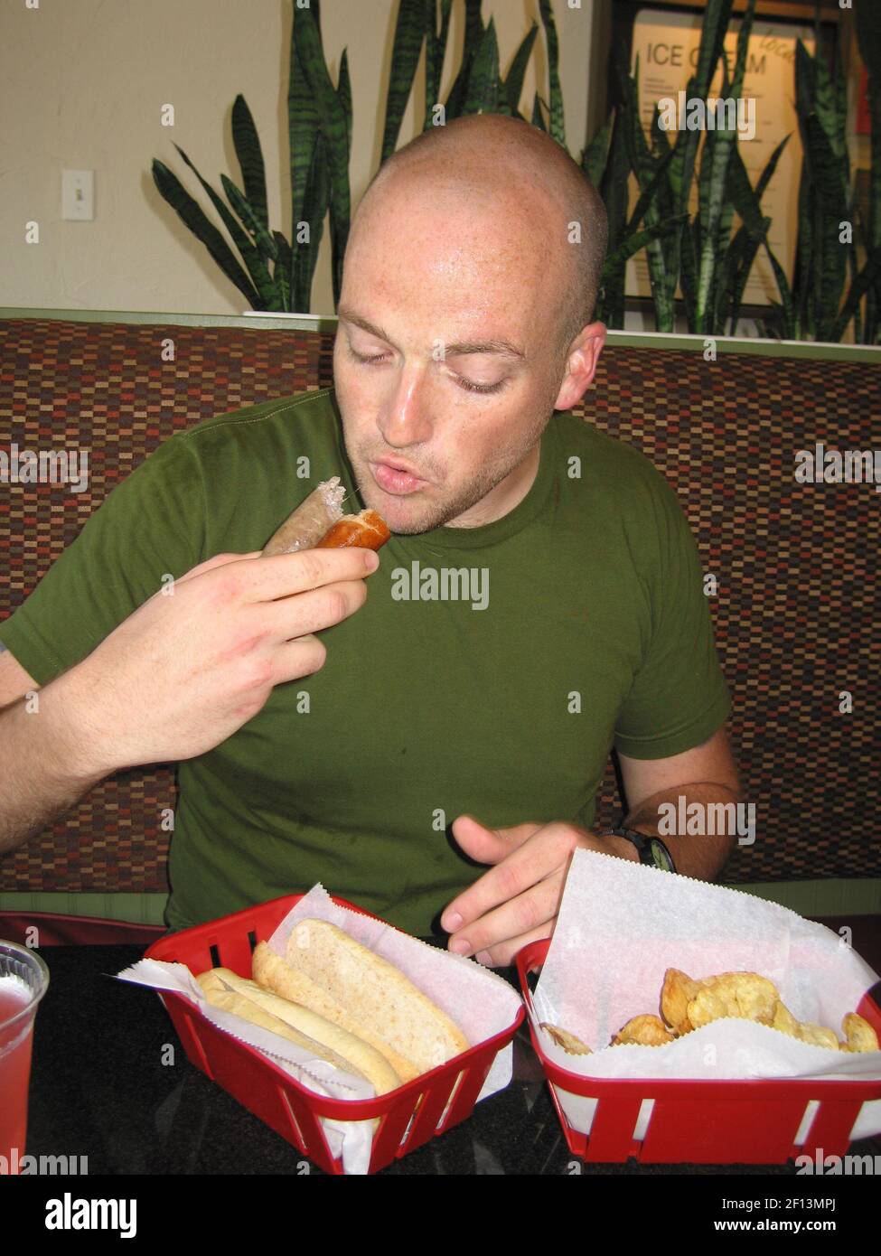 Tim "Gravy" Brown eats two hot dogs at a time, which is part of his ...