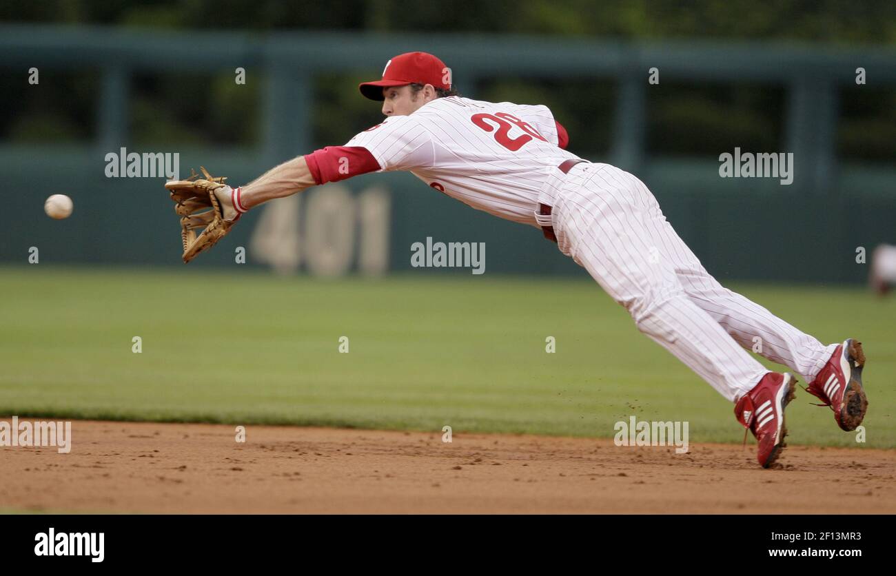 Philadelphia Phillies Chase Utley makes a catch on a hit by New York ...