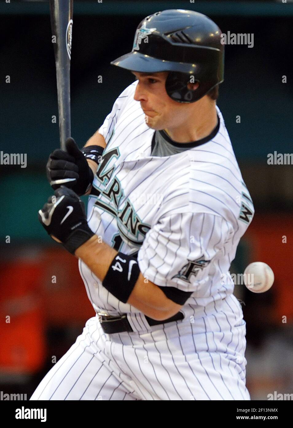 The Florida Marlins' Josh Willingham gets hit by a pitch in the first ...